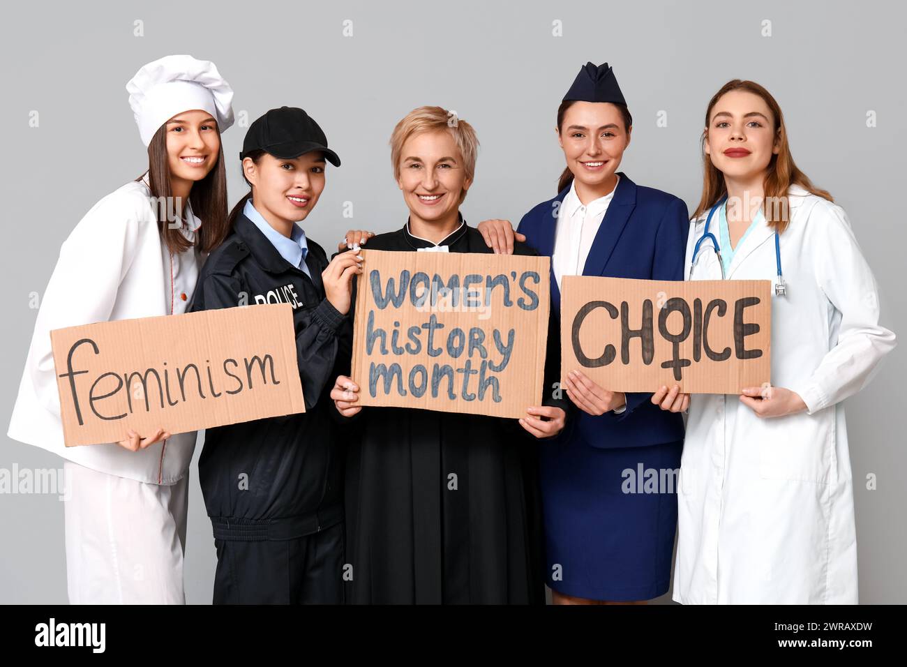 Women of different professions holding cardboard pieces with different ...