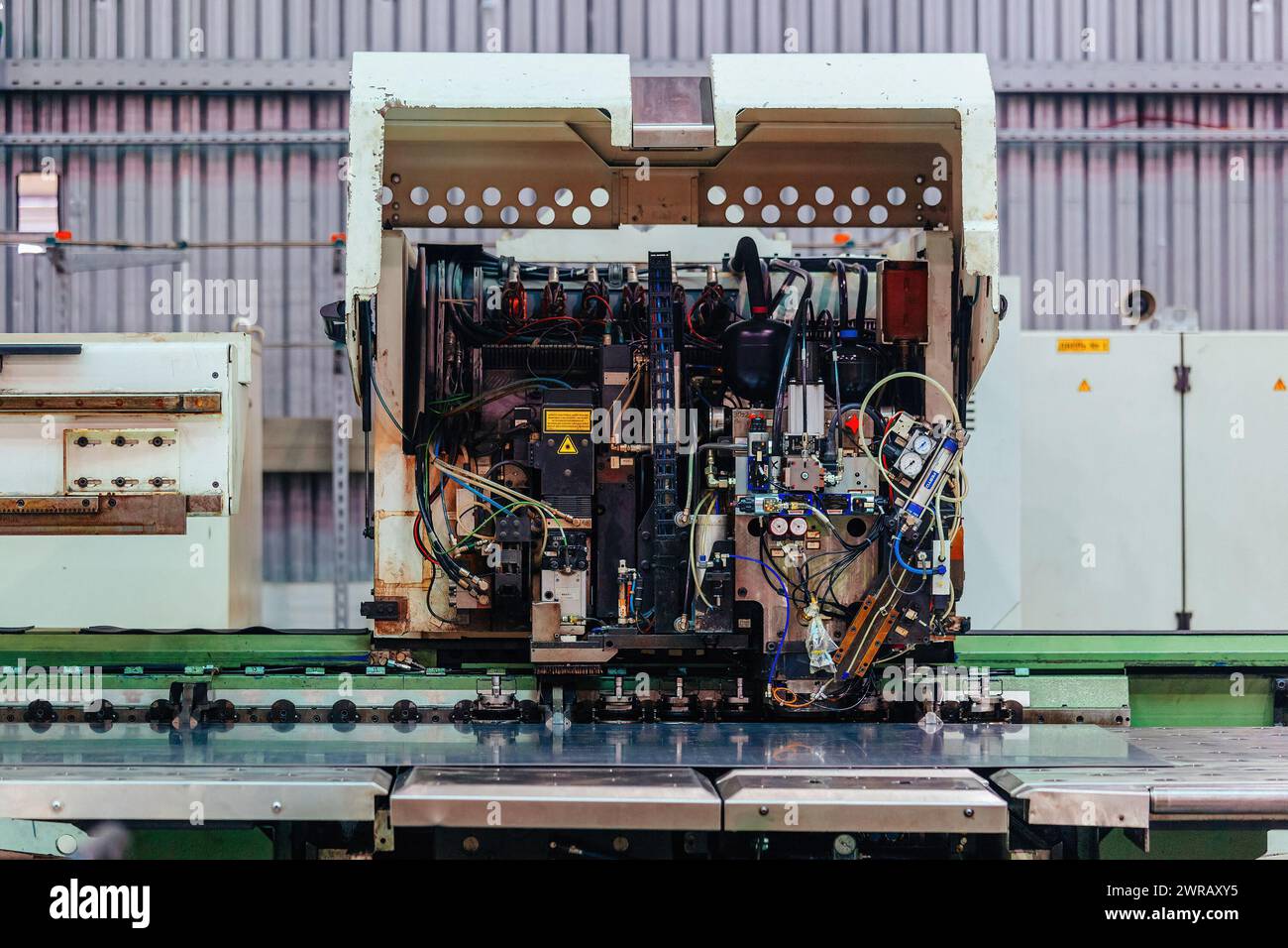 Modern CNC perforation machine in metalworking factory Stock Photo - Alamy