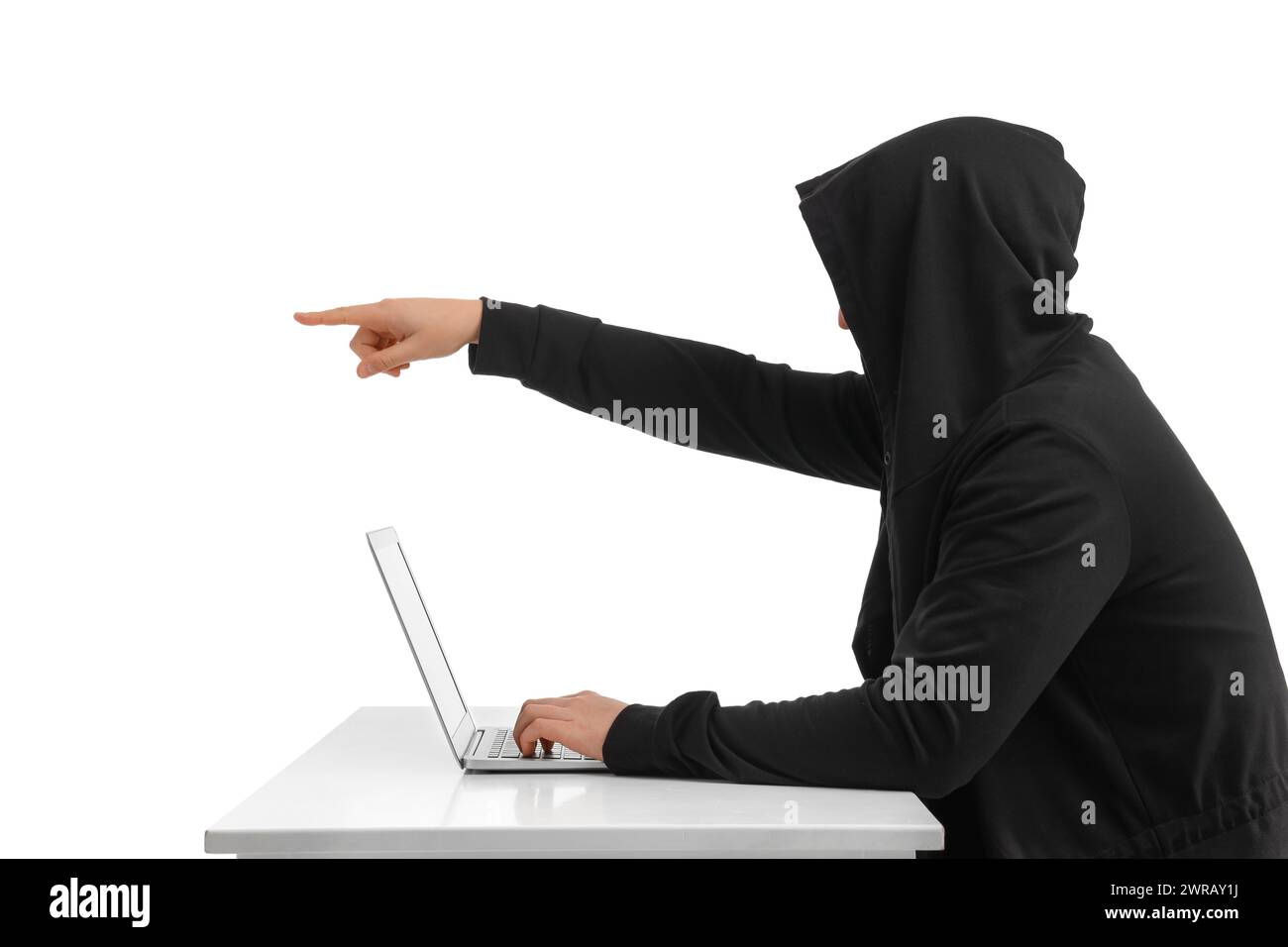 Hacker with laptop pointing at something on white background Stock ...