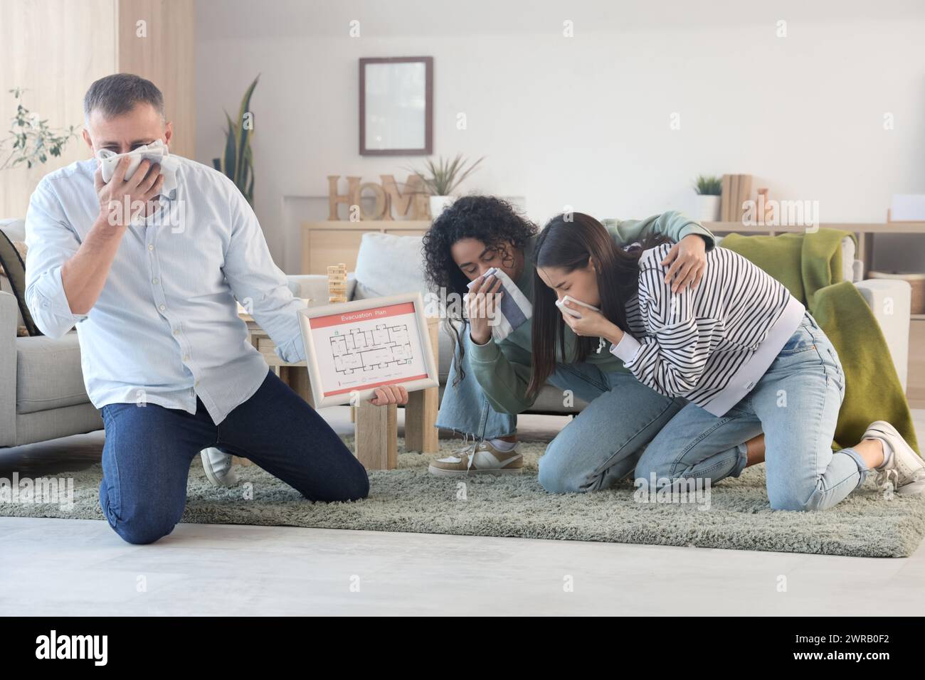 People with evacuation plan choking on smoke in burning building Stock ...