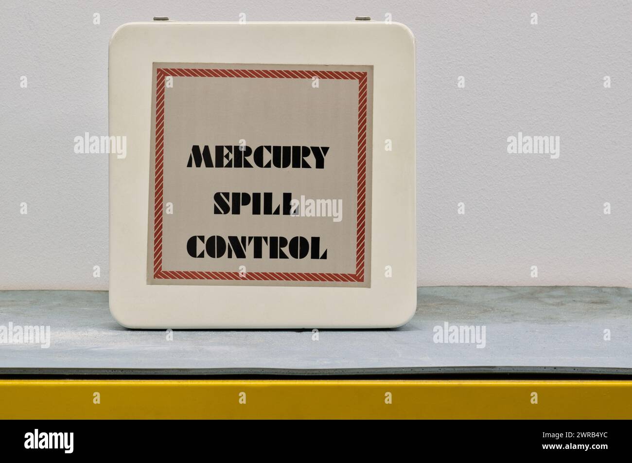 Closed Mercury spill control kit box standing upright on a shelf with ...