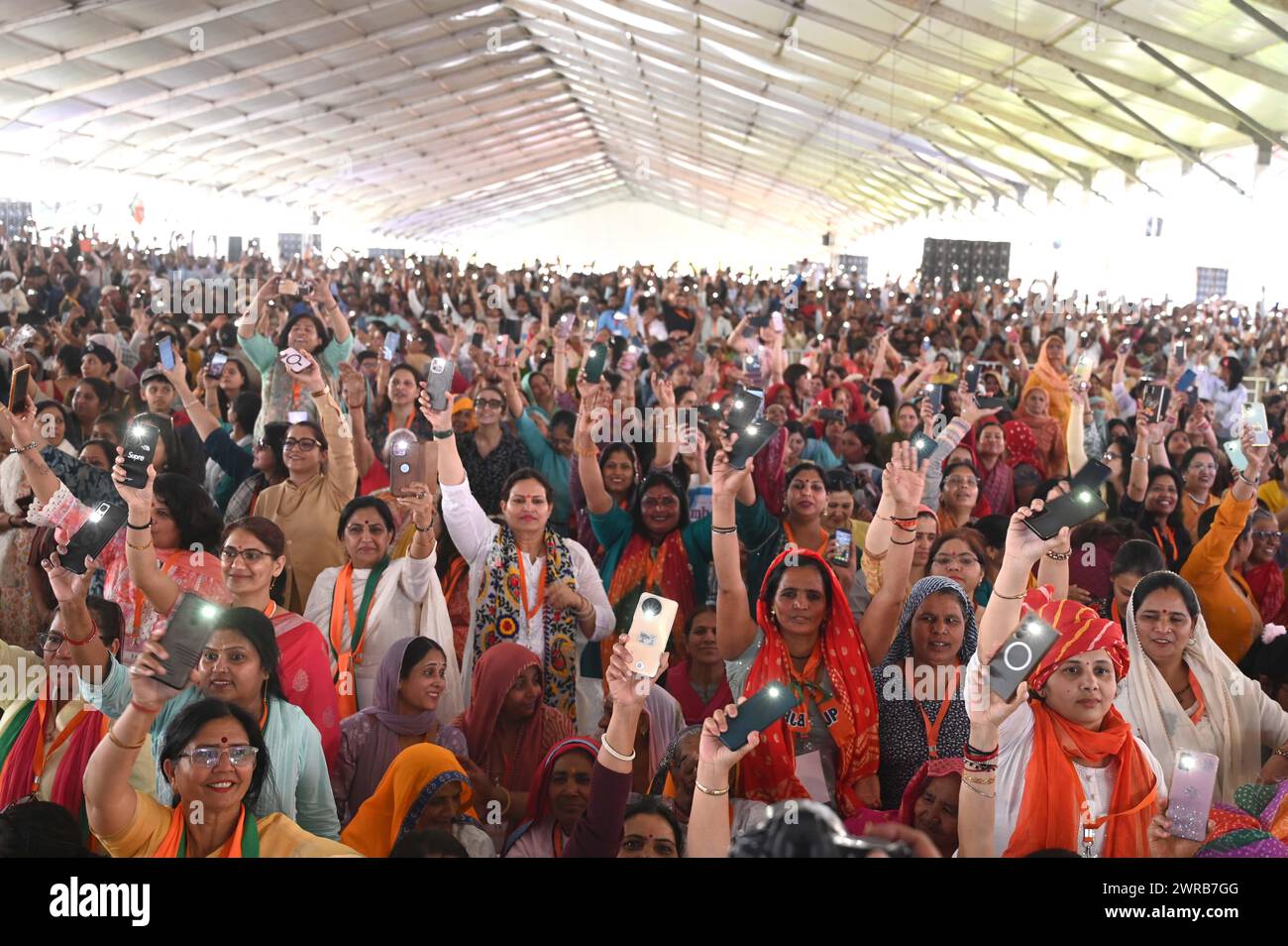 GURUGRAM, INDIA - MARCH 11: BJP workers and supporters showing mobile ...
