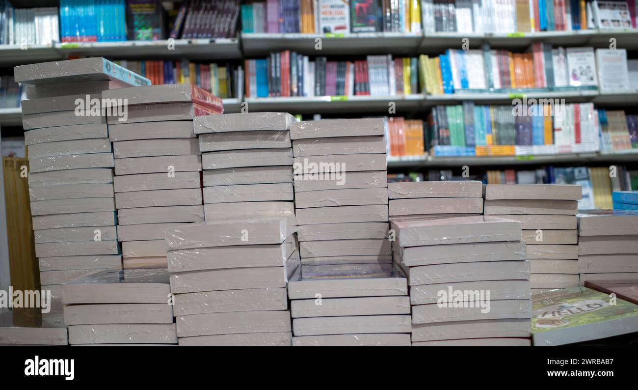 Stack or pile of books on a table in a bookstore. Education concept ...