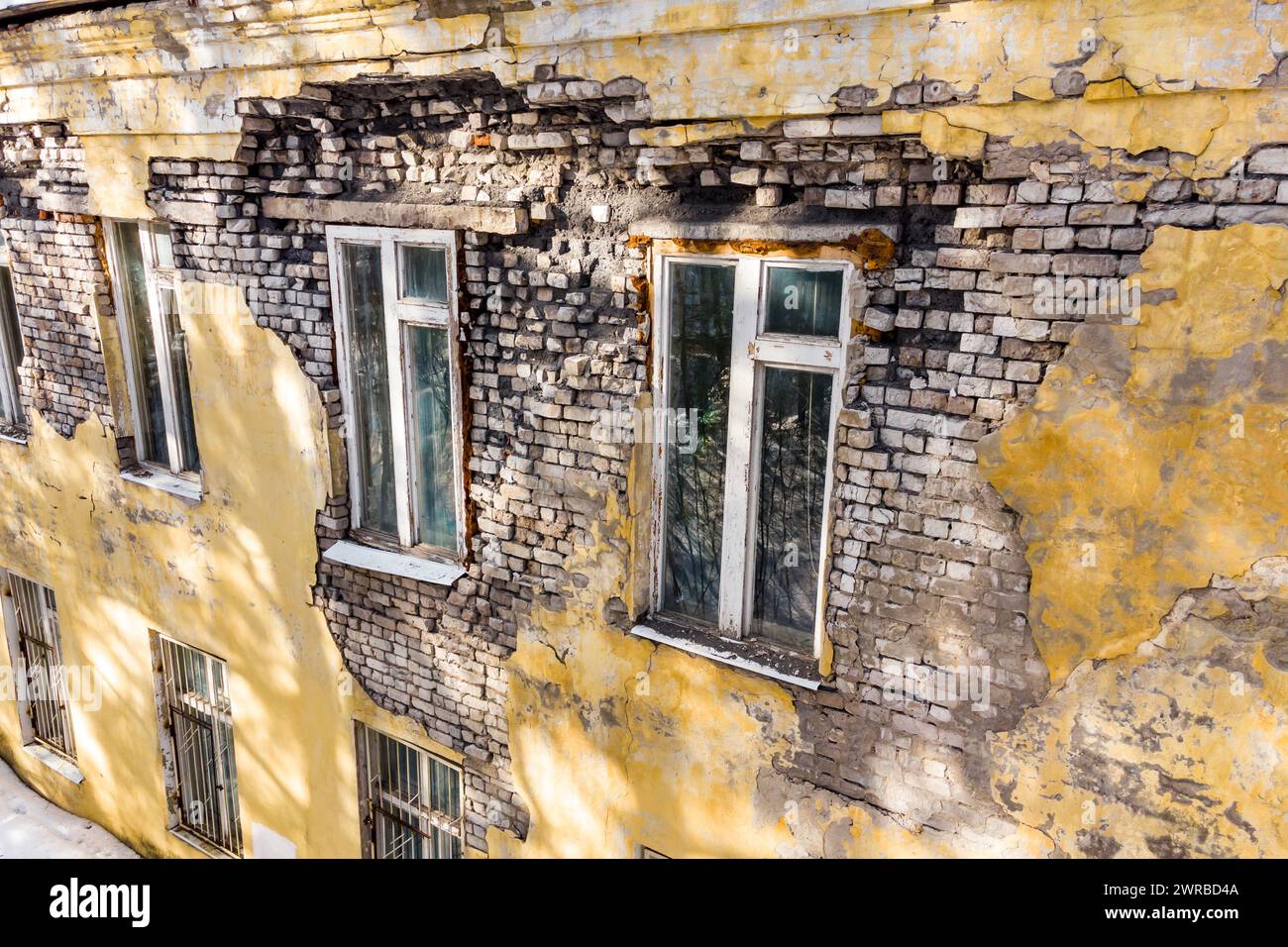 The collapsing wall of an old building made of sand-lime bricks close ...