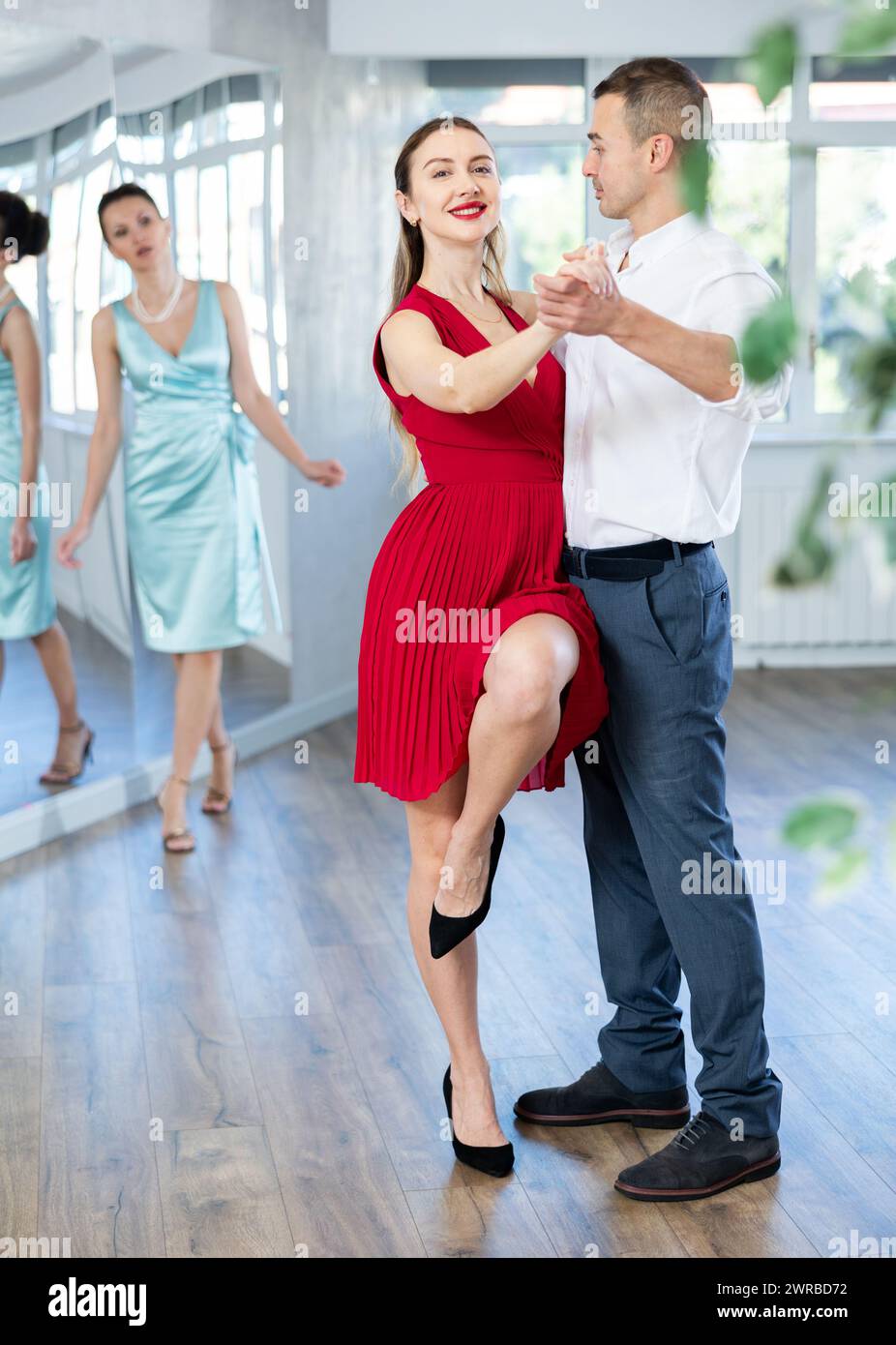 Couple in stage costumes learns boogie woogie dancing during individual ...