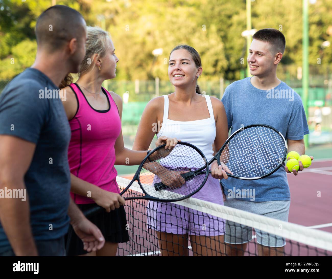 Group photo of positive people talking Stock Photo - Alamy
