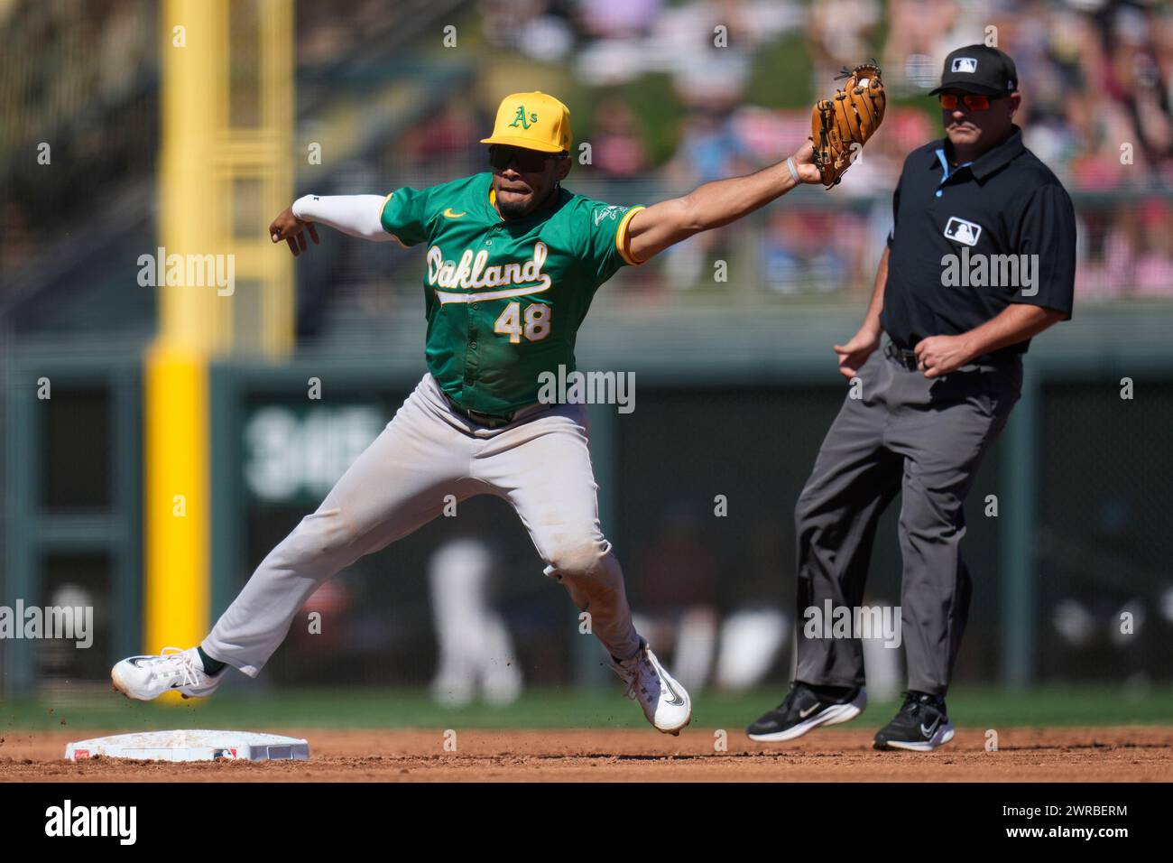 Oakland Athletics shortstop Darell Hernaiz, left, reaches for a wide ...
