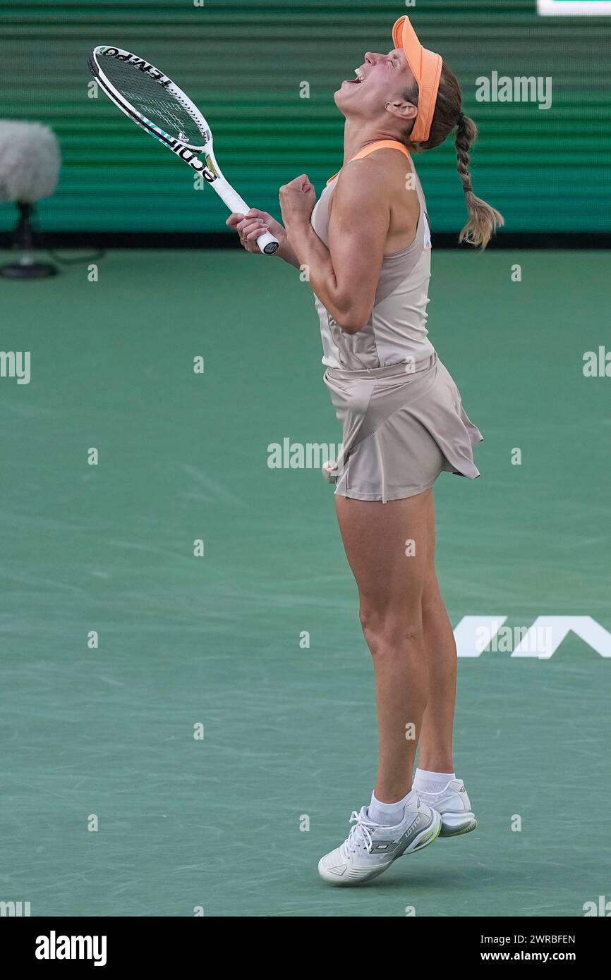 Elise Mertens, of Belgium, celebrates after defeating Naomi Osaka, of ...