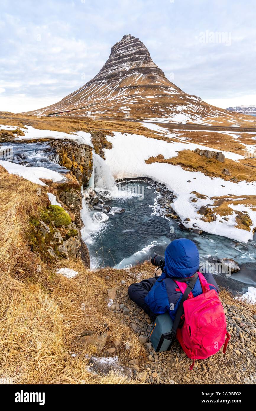 Adventurous photographer woman in winter in Iceland photographing ...