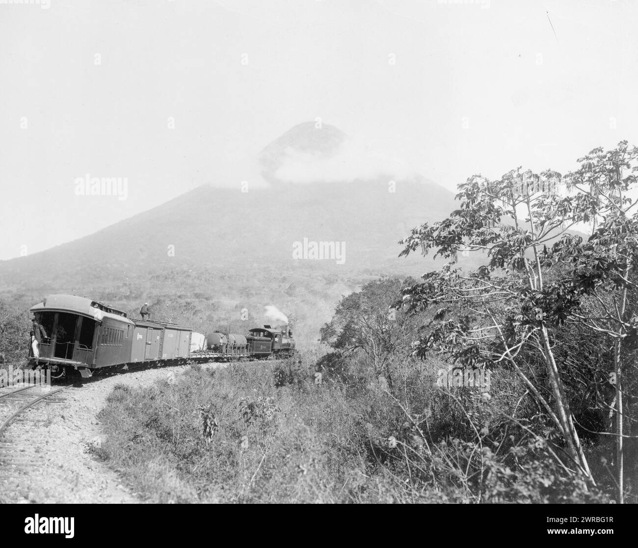Central Railroad and Volcano de Agua, Guatemala, Train on tracks ...