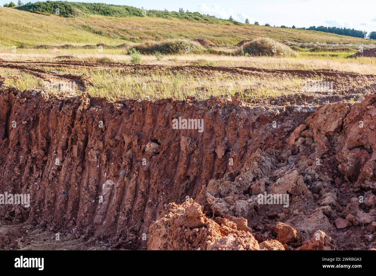 Layer of clay soil buried by an excavator bucket Stock Photo - Alamy