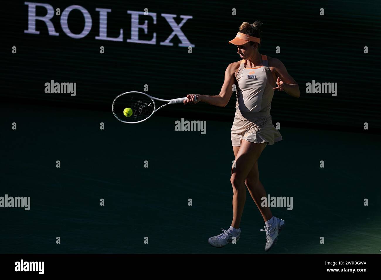 Elise Mertens, of Belgium, returns a shot against Naomi Osaka, of Japan ...