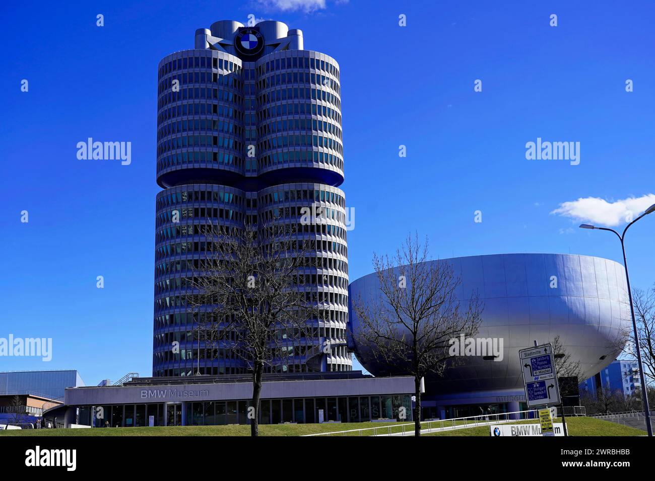 BMW Welt next to the cylindrical BMW Museum building on a sunny day ...