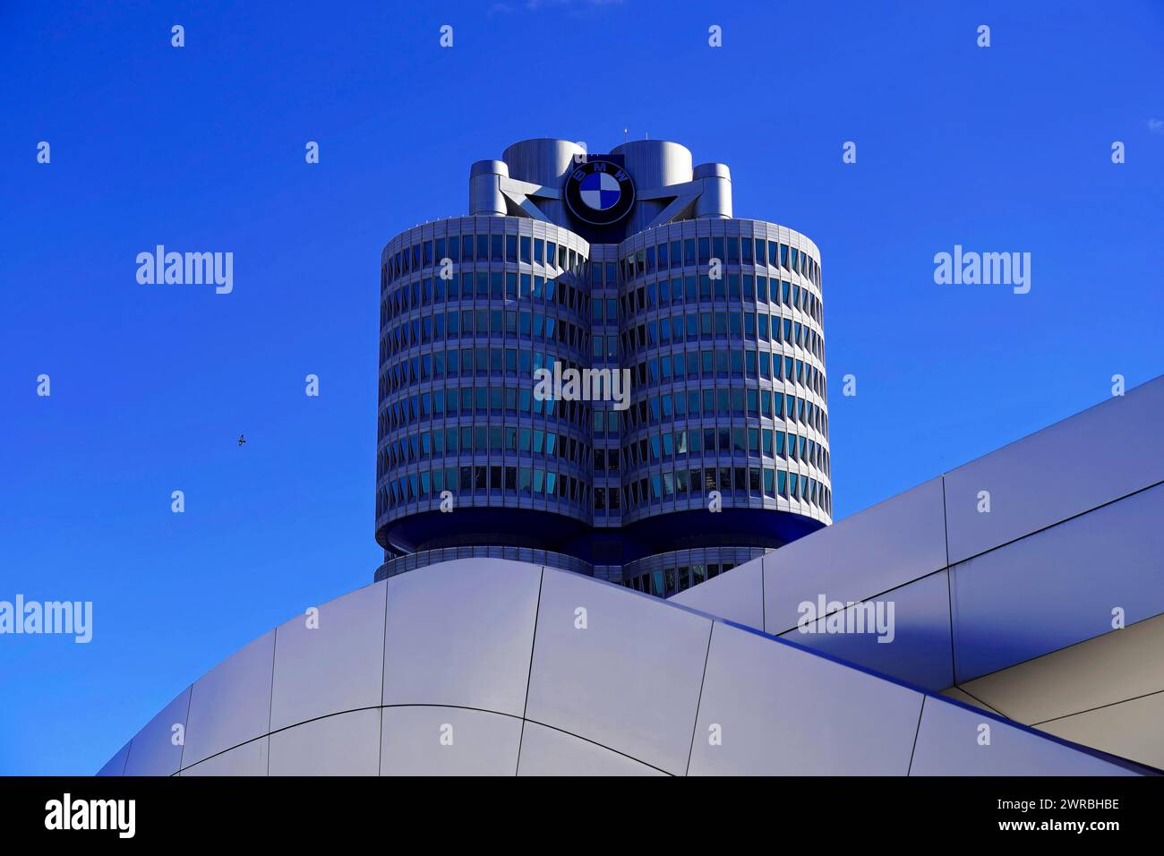 The iconic BMW building shines in the light of dusk, BMW WELT, Munich ...