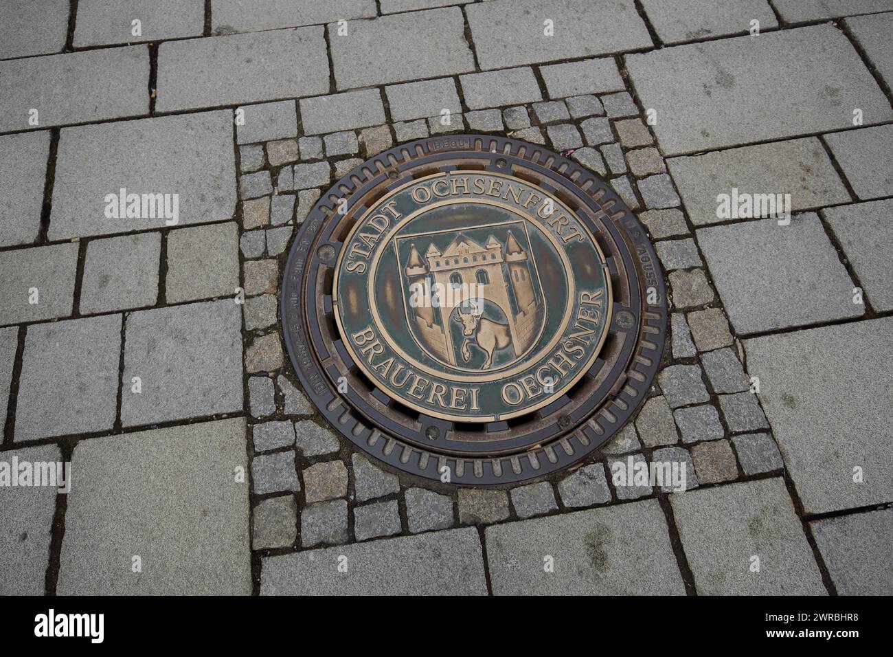 Manhole cover with inscription brewery, town, ground, round, main ...