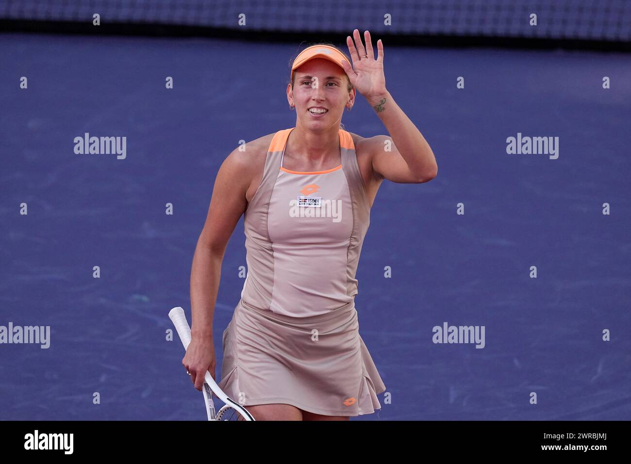 Elise Mertens, of Belgium, celebrates after defeating Naomi Osaka, of ...