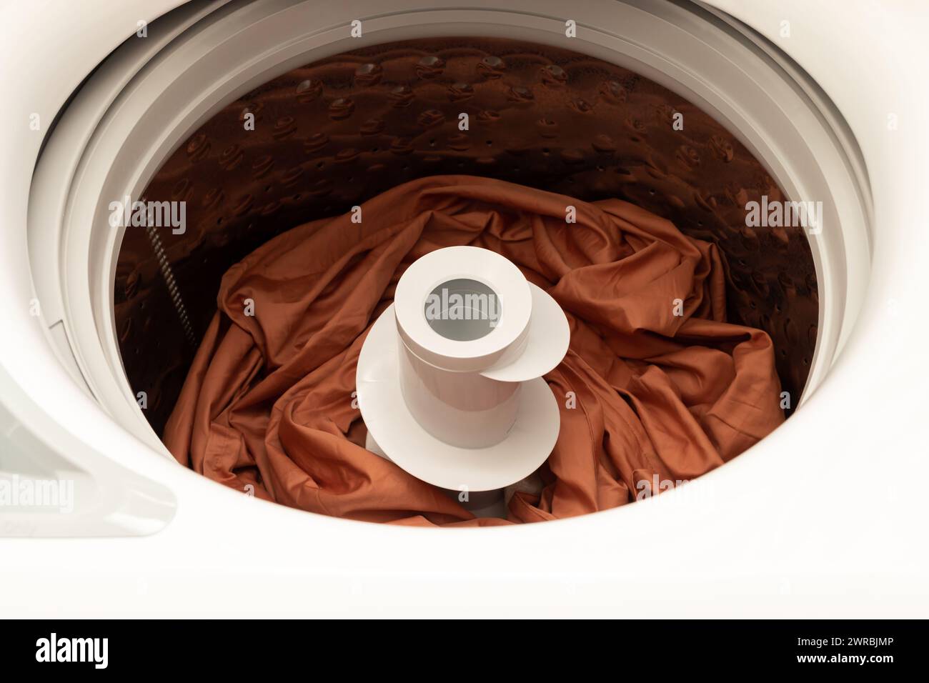 Top Loading Washing Machine With Colorful Bed Linen Inside. Laundry ...