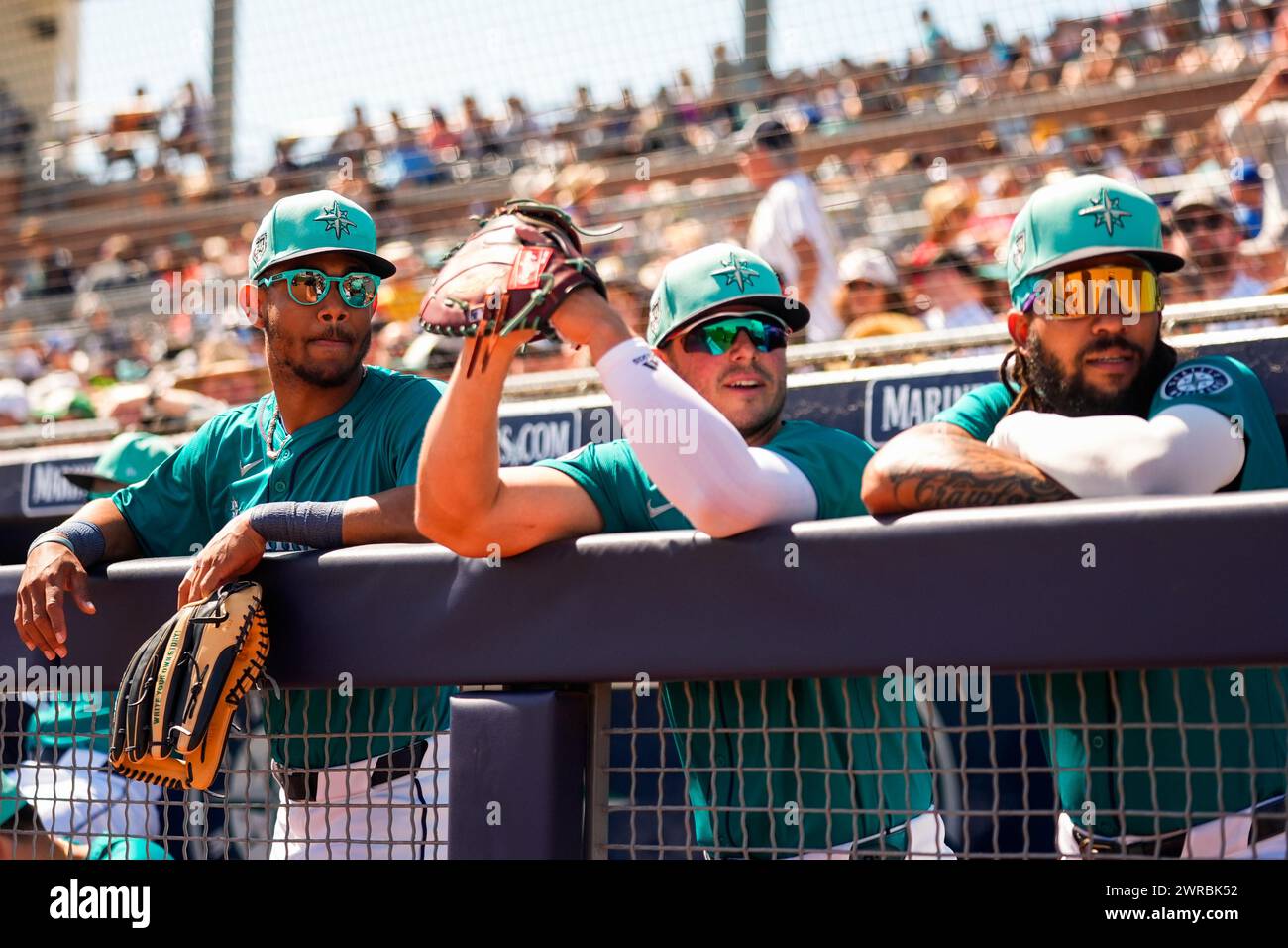 Seattle Mariners center fielder Julio Rodríguez, left, stands with ...