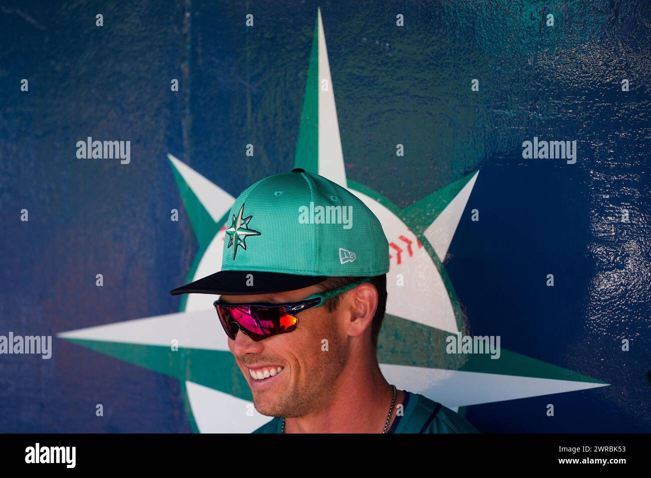 Seattle Mariners left fielder Cade Marlowe smiles in the dugout before ...