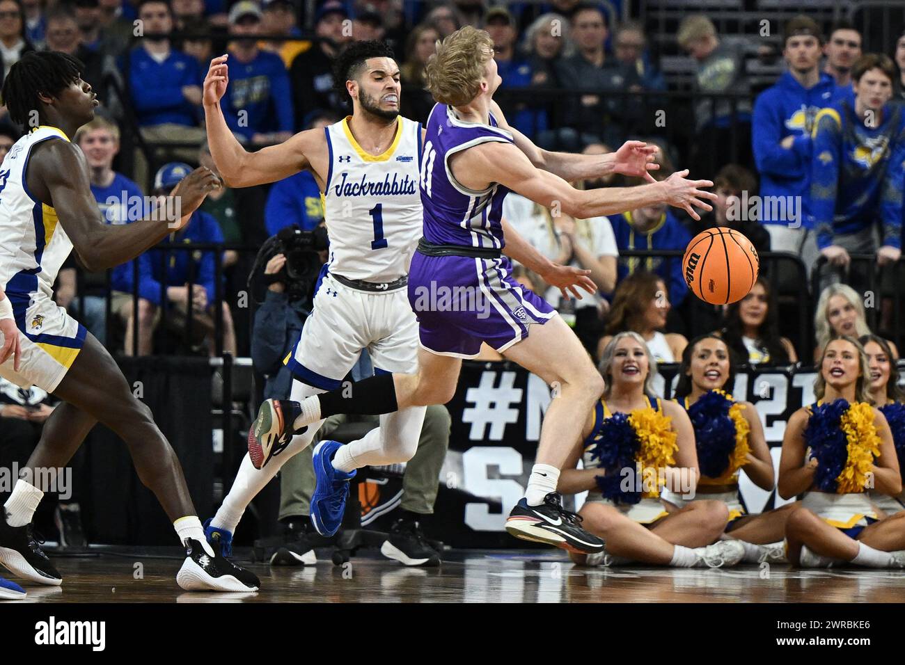 South Dakota State Jackrabbits guard Matt Mims (1) fouls St. Thomas ...