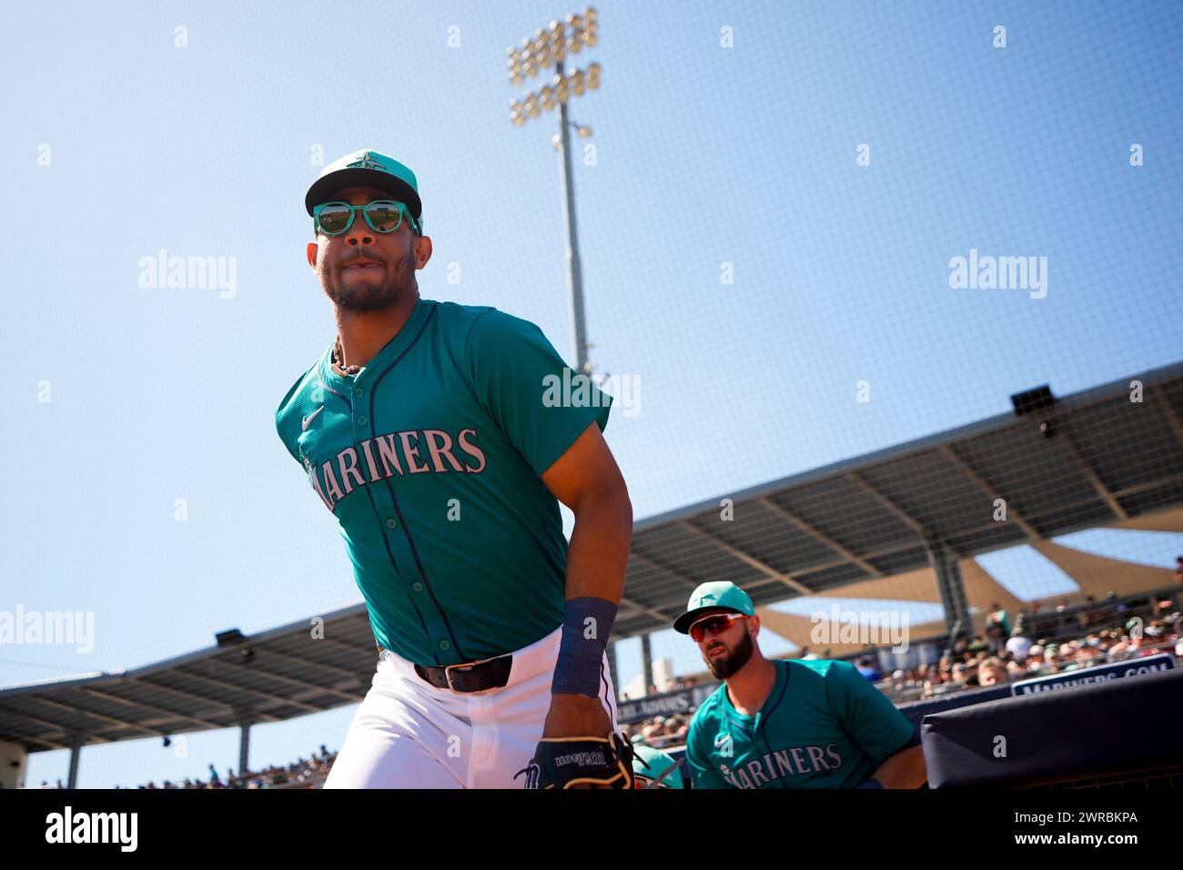 Seattle Mariners center fielder Julio Rodríguez jogs out to the field ...