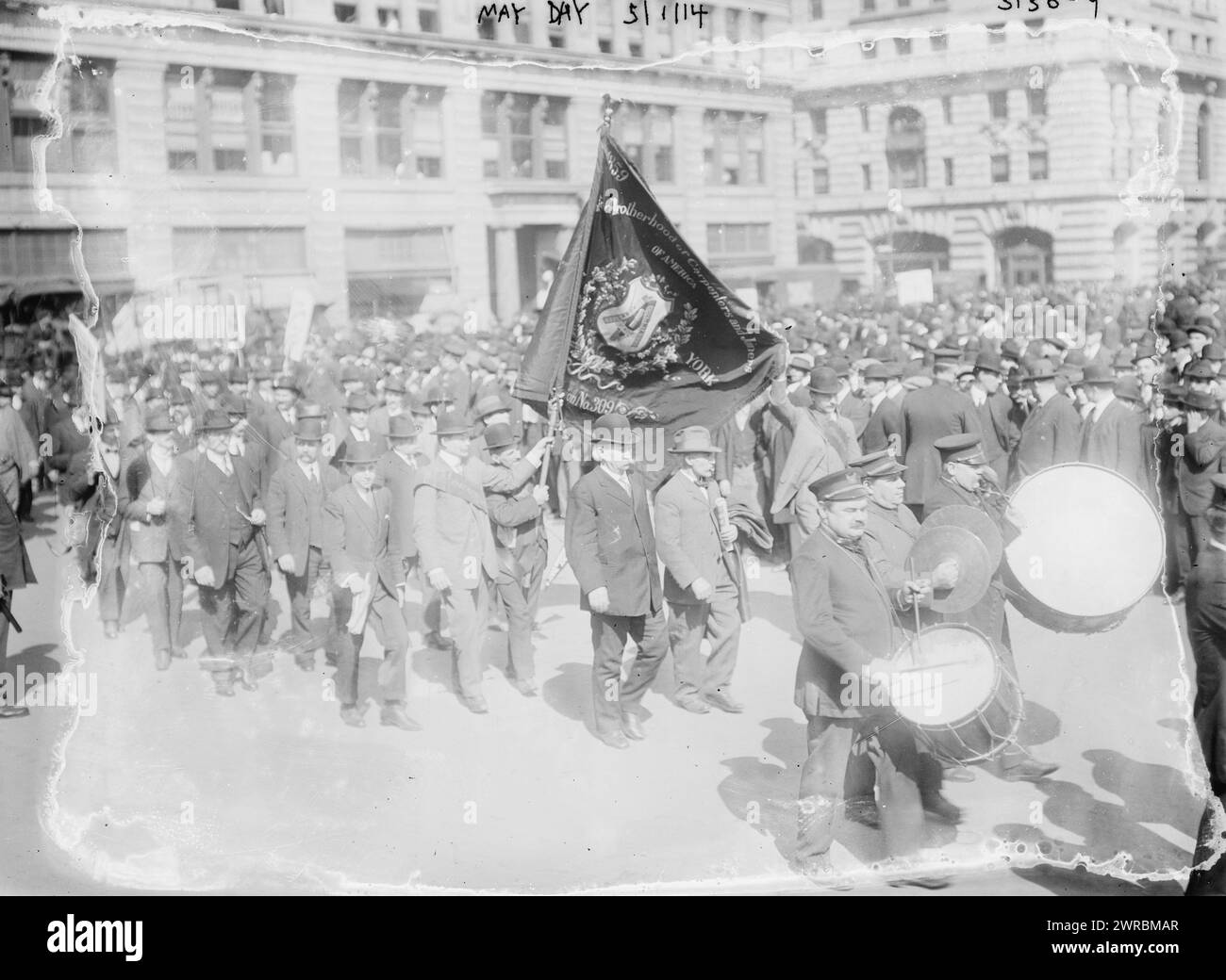 May Day, 5/1/14, Photograph shows men with a banner for the Brotherhood ...
