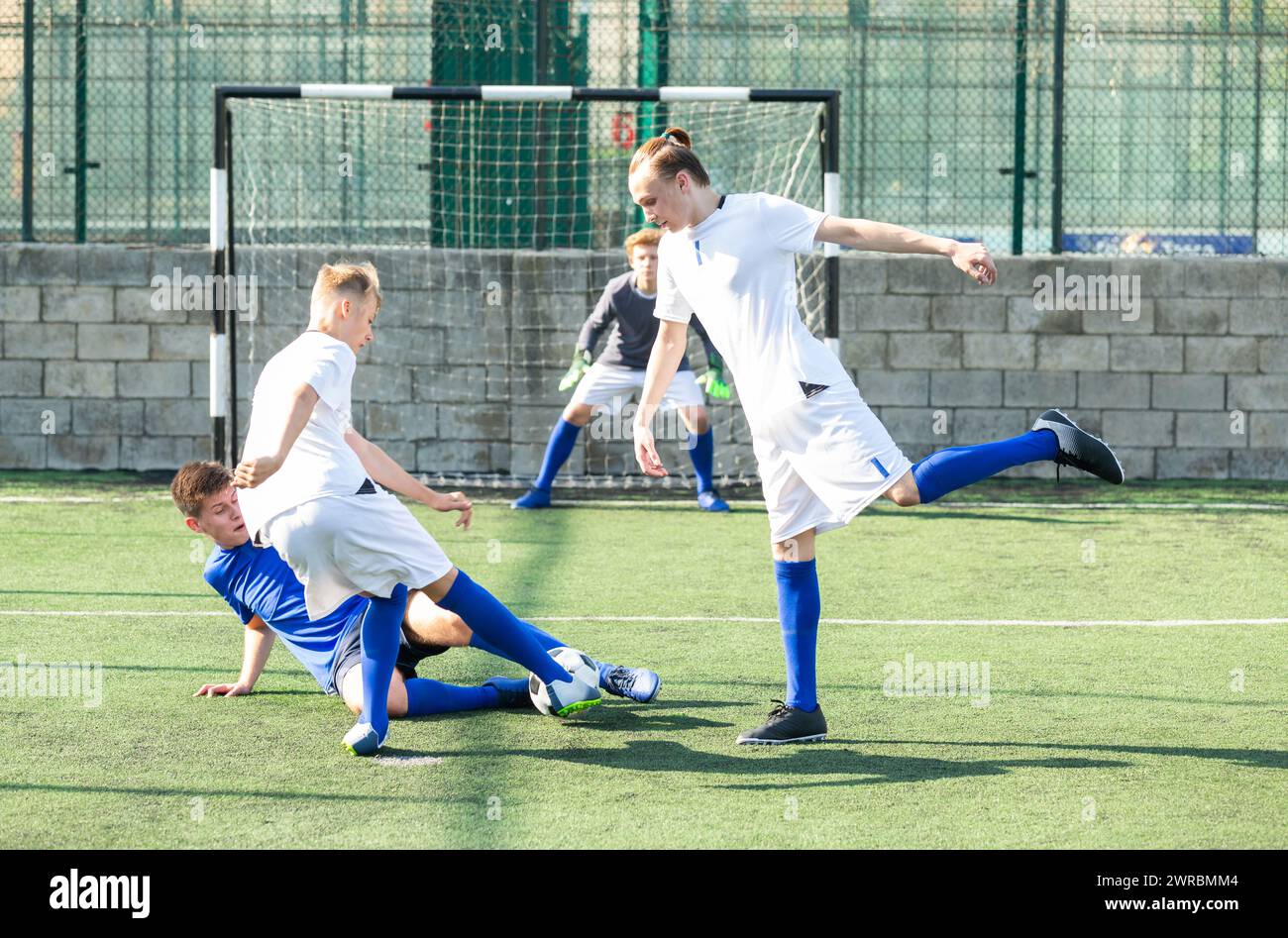 Teens playing soccer football match. Competition between two youth ...