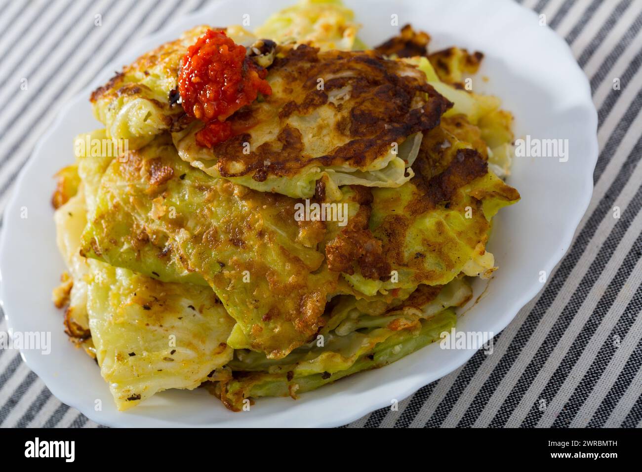 Cabbage in batter with adjika sauce Stock Photo - Alamy