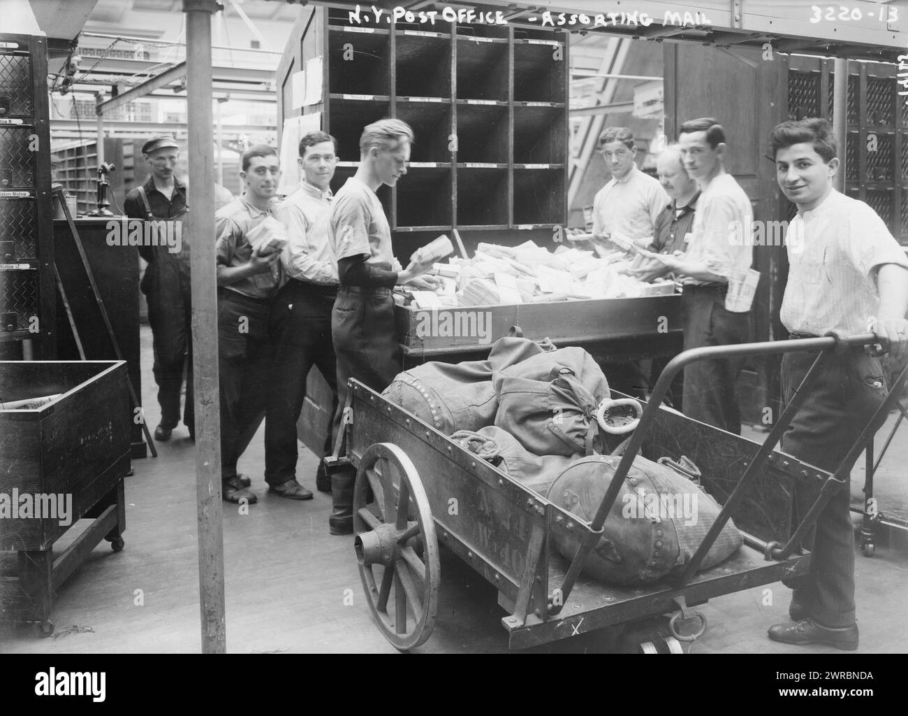N. Y. Post Office, assorting i.e., sorting mail, Photograph shows men ...