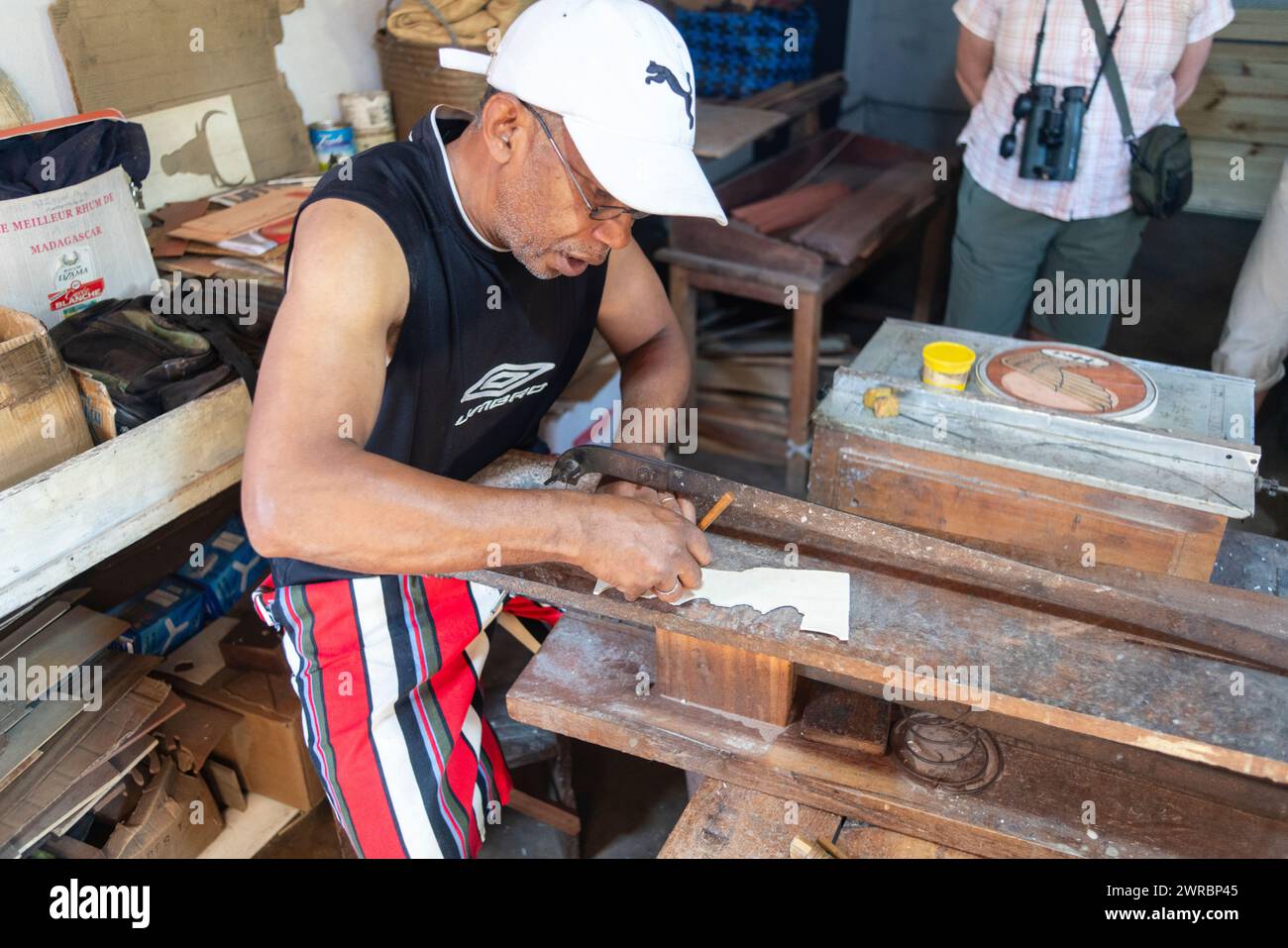 Craftsman creating marquetry in Ambositra, Amoron I Mania, Madagascar ...