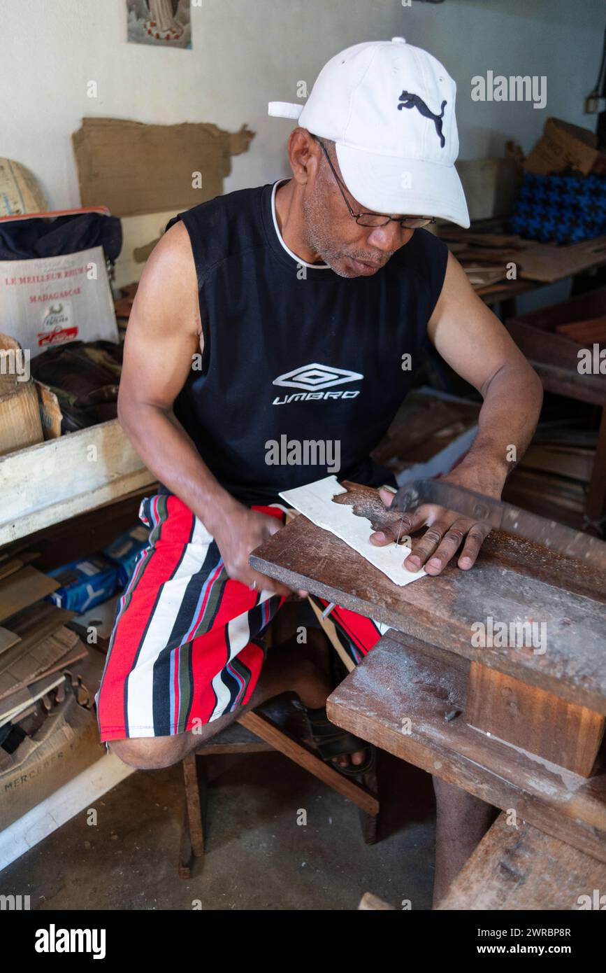 Craftsman creating marquetry in Ambositra, Amoron I Mania, Madagascar ...