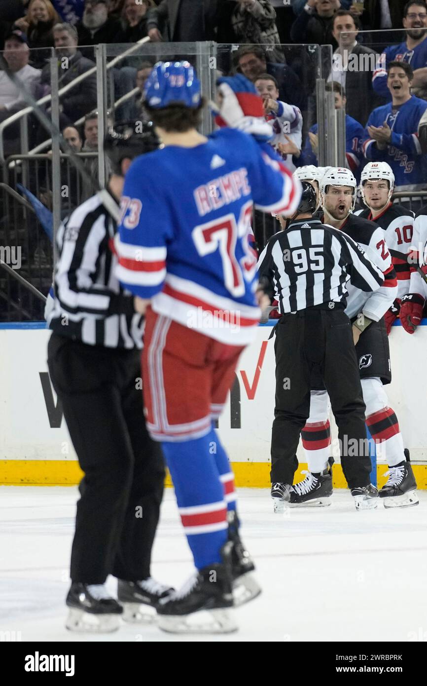 New York Rangers' Matt Rempe, left, waves as New Jersey Devils' Kurtis ...