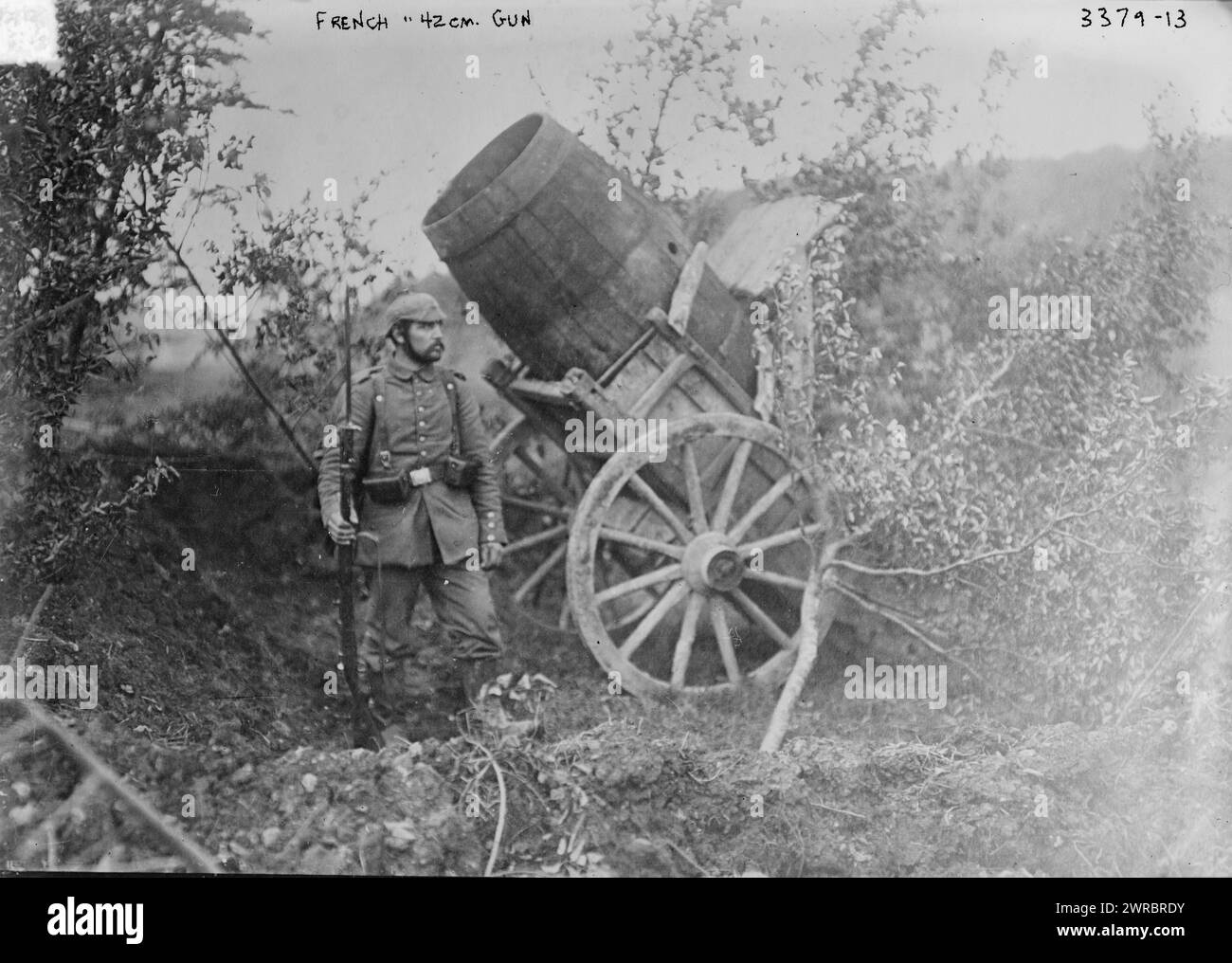 French '42 cm. gun, Photograph shows a barrel mounted on a small cart ...