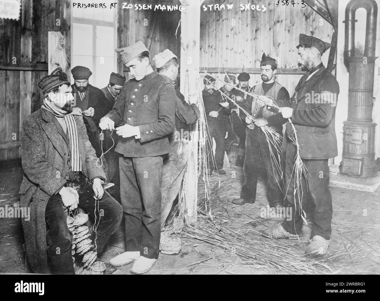 Prisoners at Zossen making straw shoes, Photograph shows prisoners ...