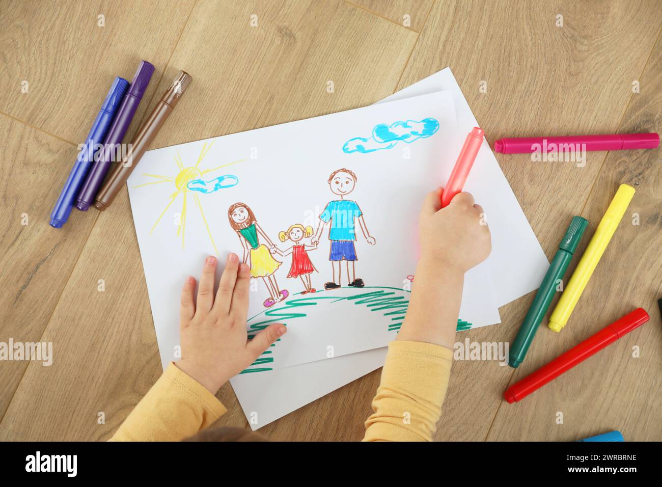 Little girl drawing with marker on floor, top view. Child`s art Stock ...