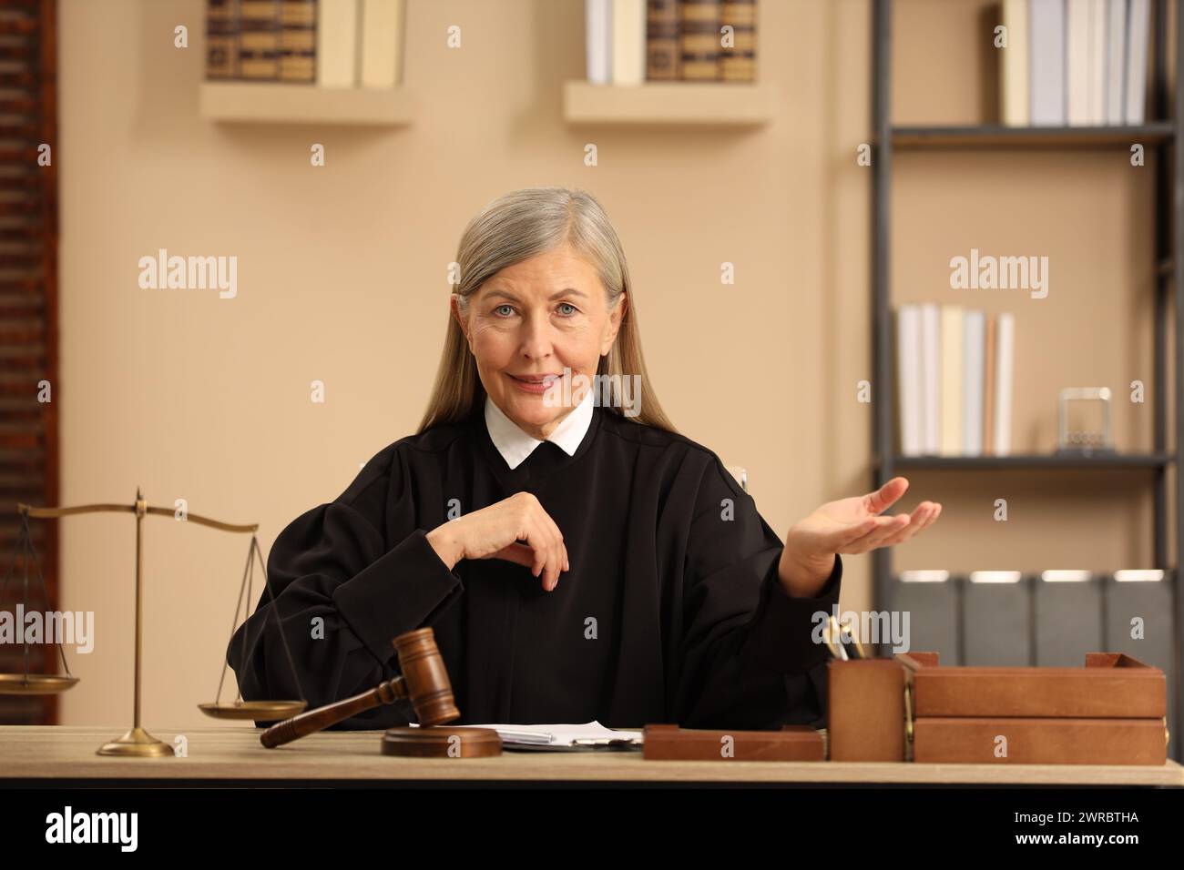 Mature female judge scales hi-res stock photography and images - Alamy