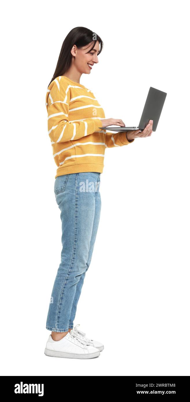 Happy woman using laptop on white background Stock Photo - Alamy