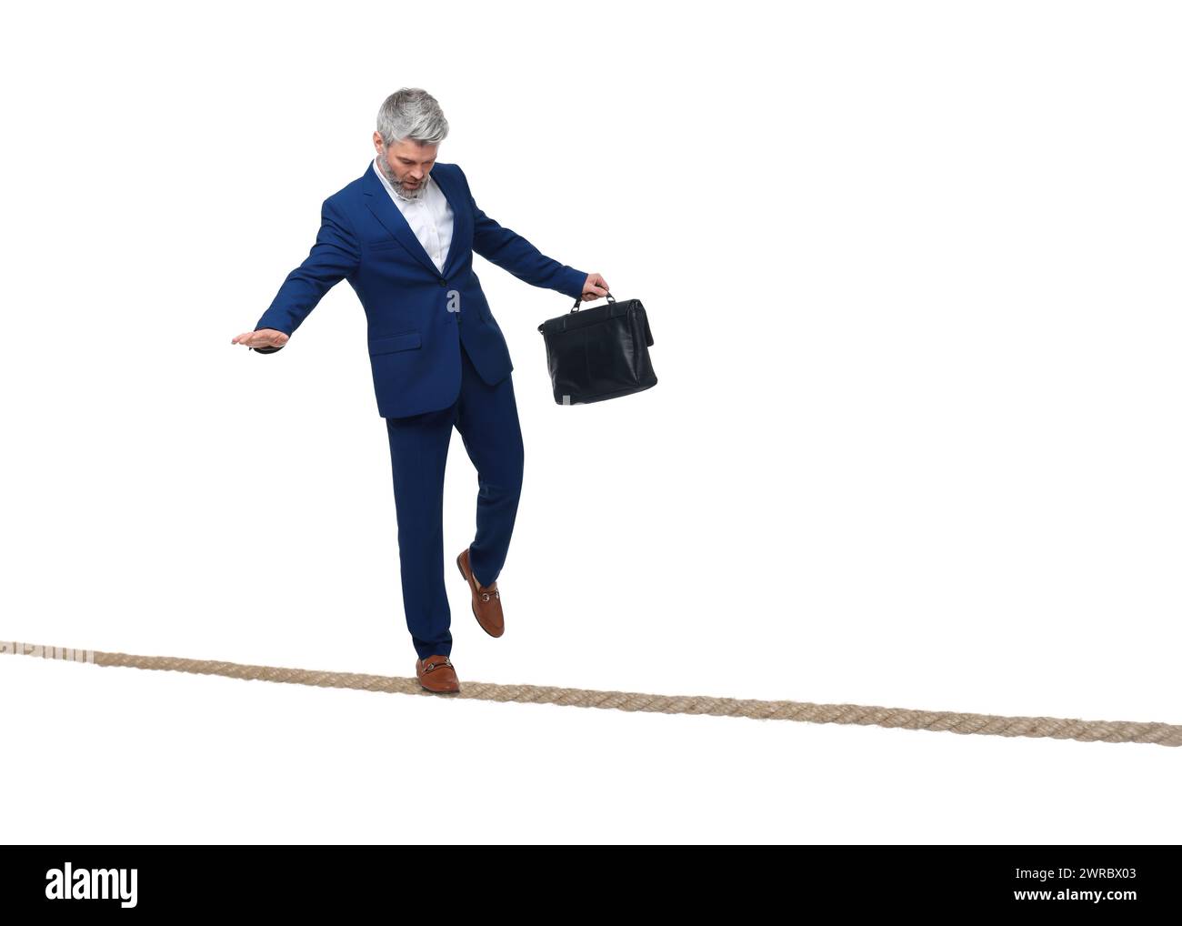 Risks and challenges of owning business. Man with briefcase balancing ...