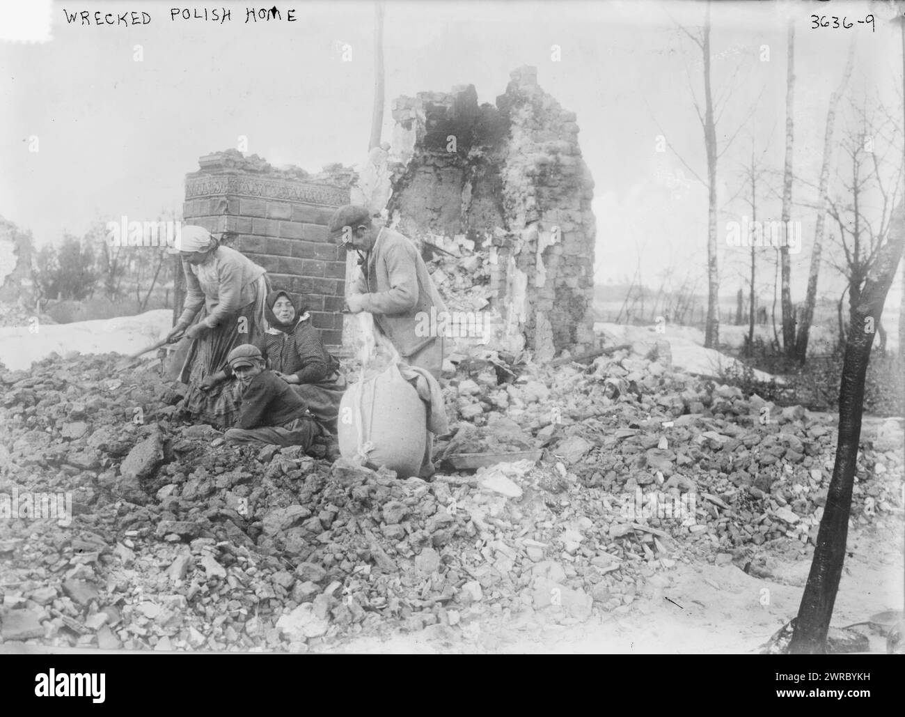 Wrecked Polish home, Photograph shows a man, women and a child going ...