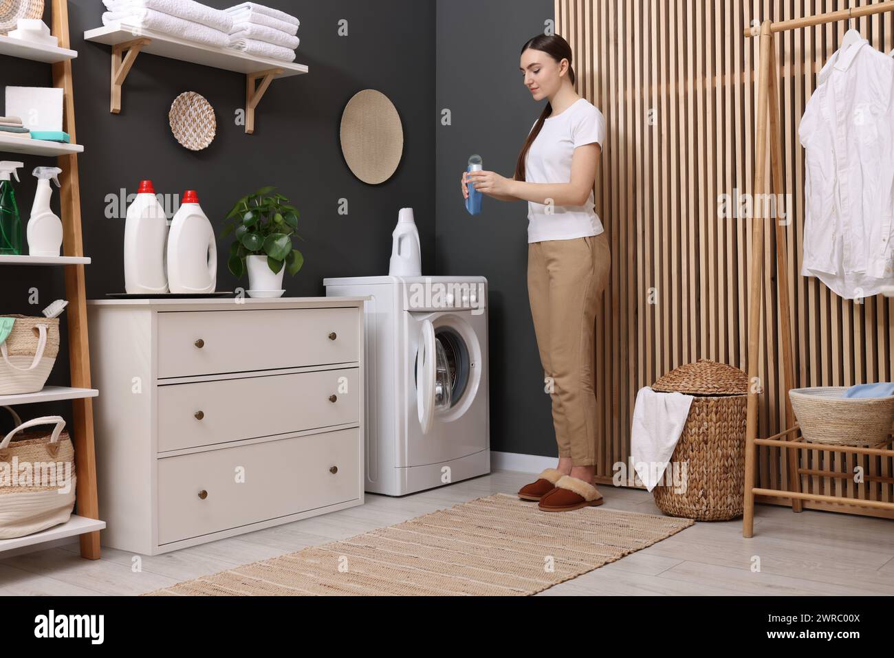 Woman pouring detergent cap hi-res stock photography and images - Alamy