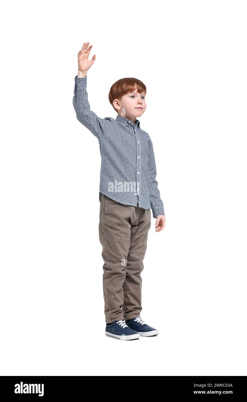 Little boy waving hand on white background Stock Photo - Alamy