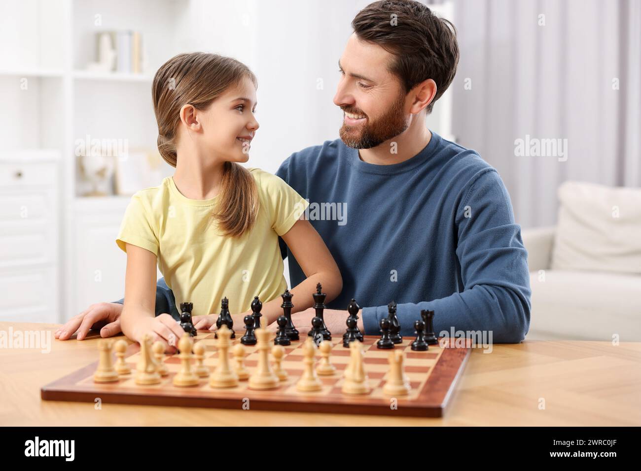 Father daughter playing chess home hi-res stock photography and images ...
