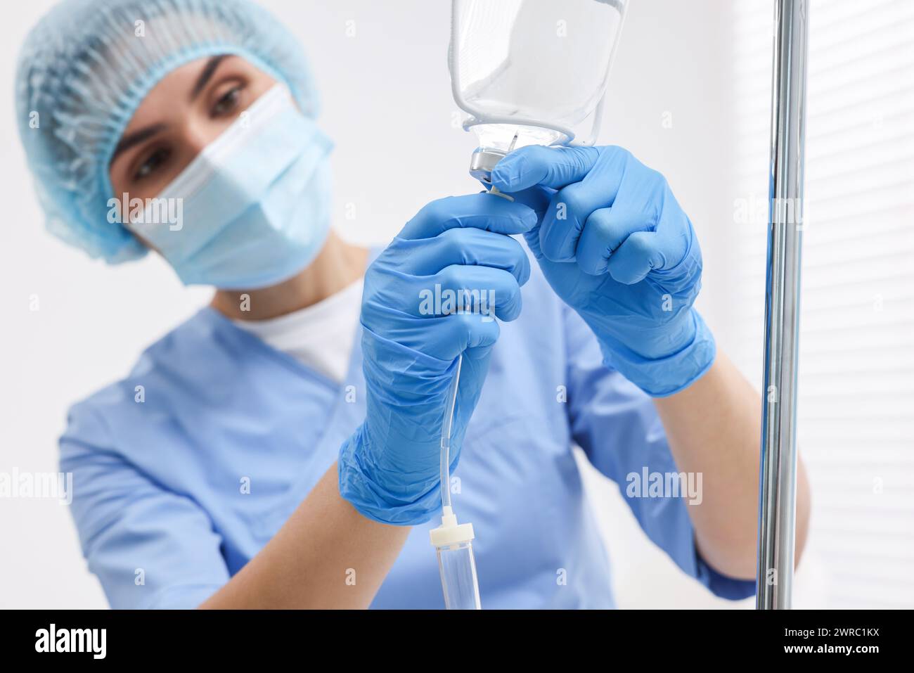 Nurse setting up IV drip in hospital, selective focus Stock Photo - Alamy