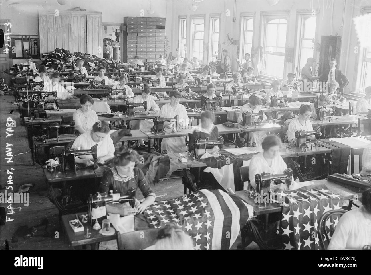 Flag shop, Navy Yard, Photograph shows women making flags on sewing ...