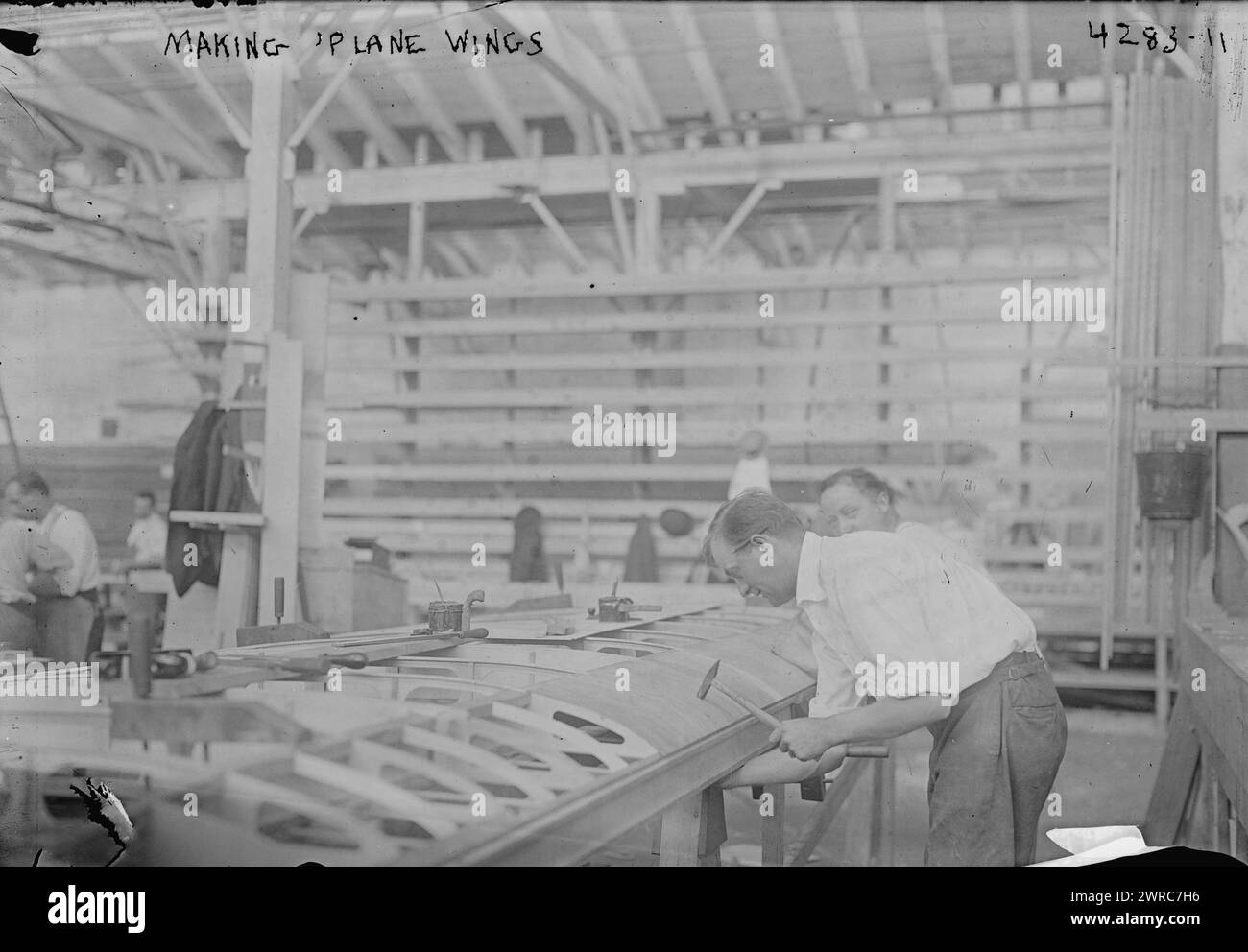 Making plane wings, Photograph shows workers making airplane wings at ...