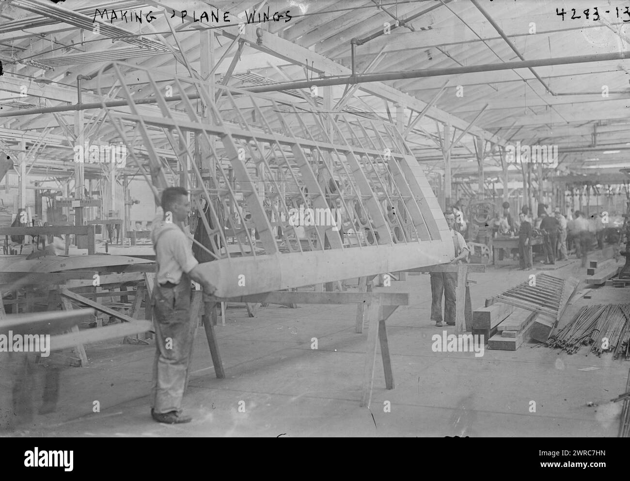 Making plane wings, Photograph shows workers constructing airplane ...