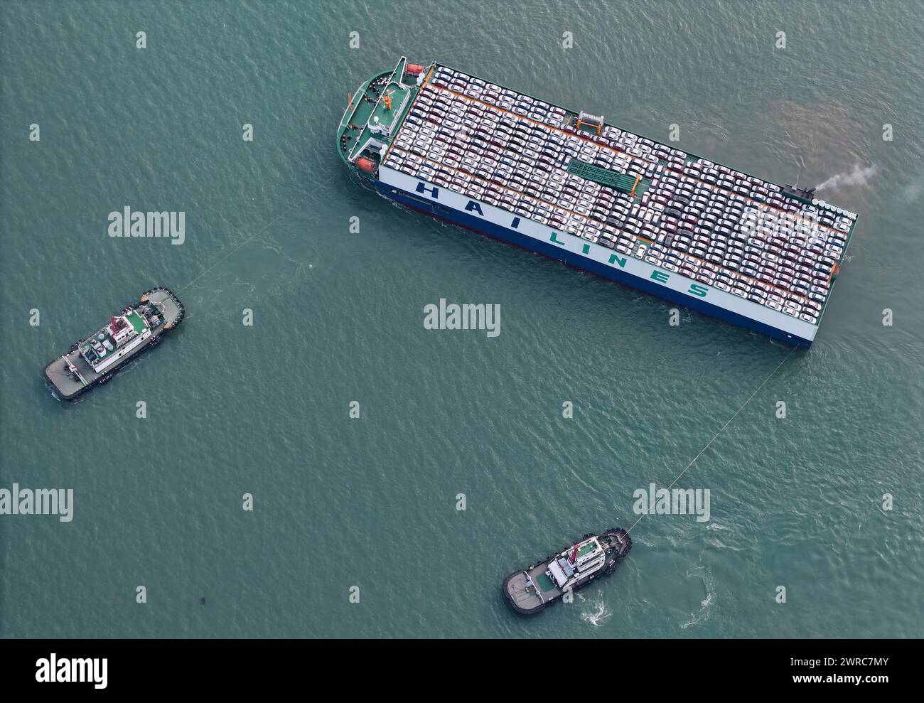 YANTAI, CHINA - MARCH 11, 2024 - A car carrier loaded with cars for ...