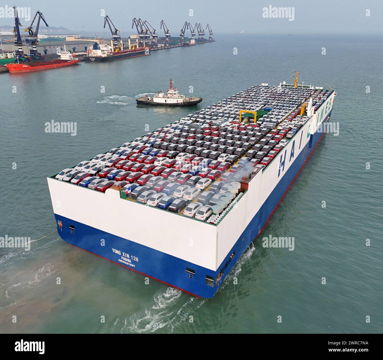 YANTAI, CHINA - MARCH 11, 2024 - A car carrier loaded with cars for ...