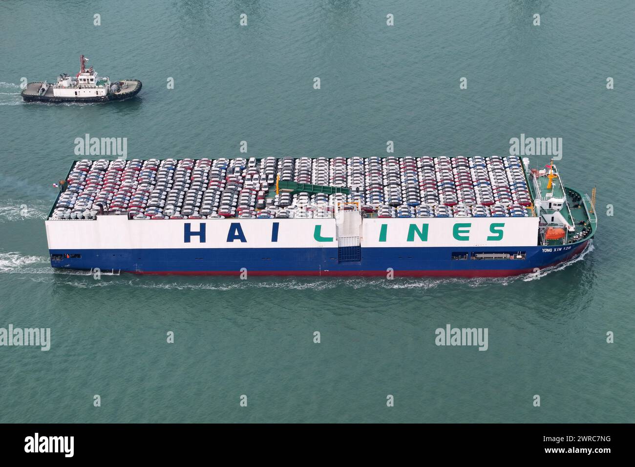 YANTAI, CHINA - MARCH 11, 2024 - A car carrier loaded with cars for ...