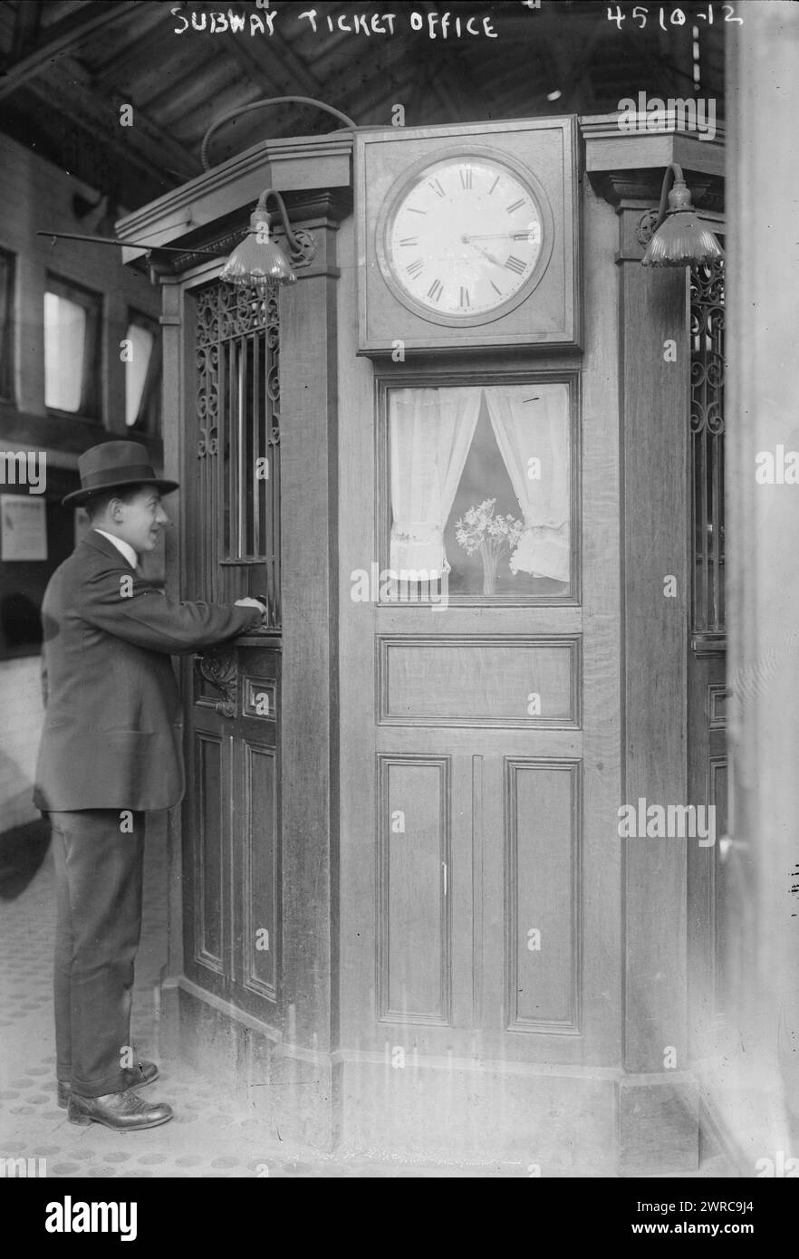 Subway ticket office, Photograph shows a man at a ticket booth ...